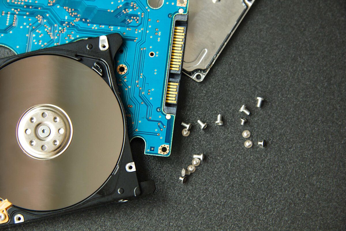 Broken,Damaged,Hard,Disk,With,Scattered,Components,Showing,Loose,Disks ...